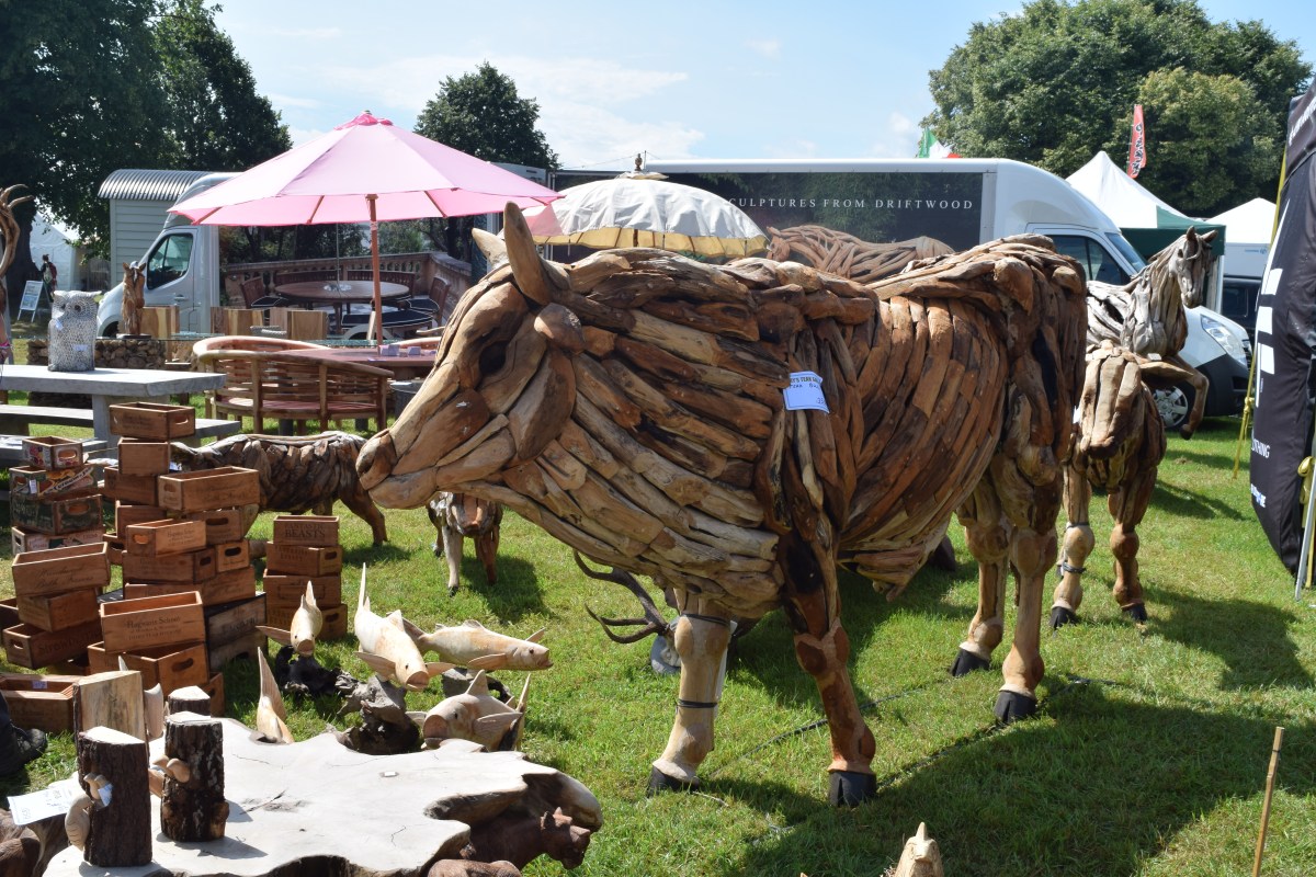 Out and about at a rural (and muddy) country fair: hay bales, antique ...